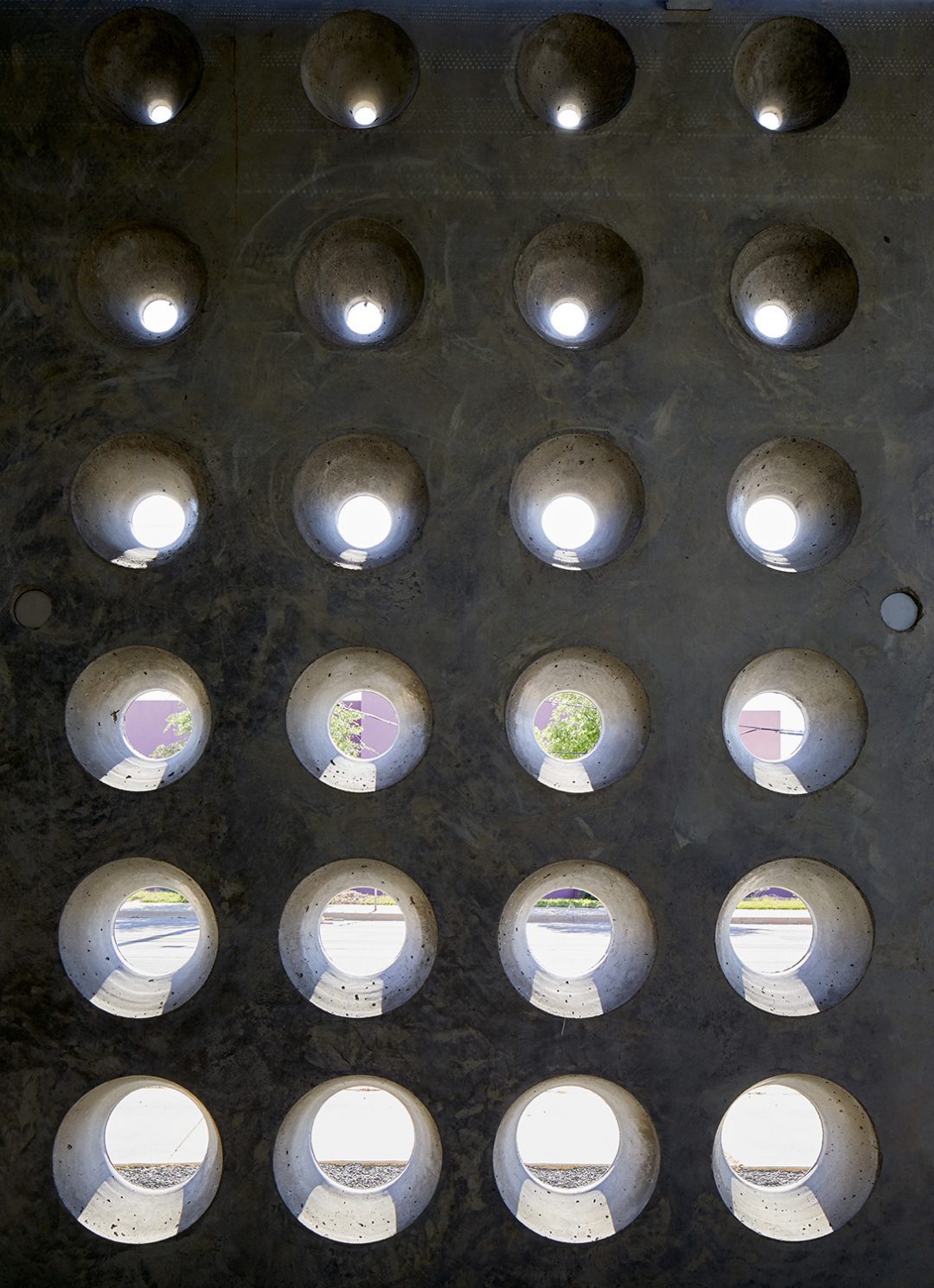 This concrete screen wall was inspired by the proportions of camera ...