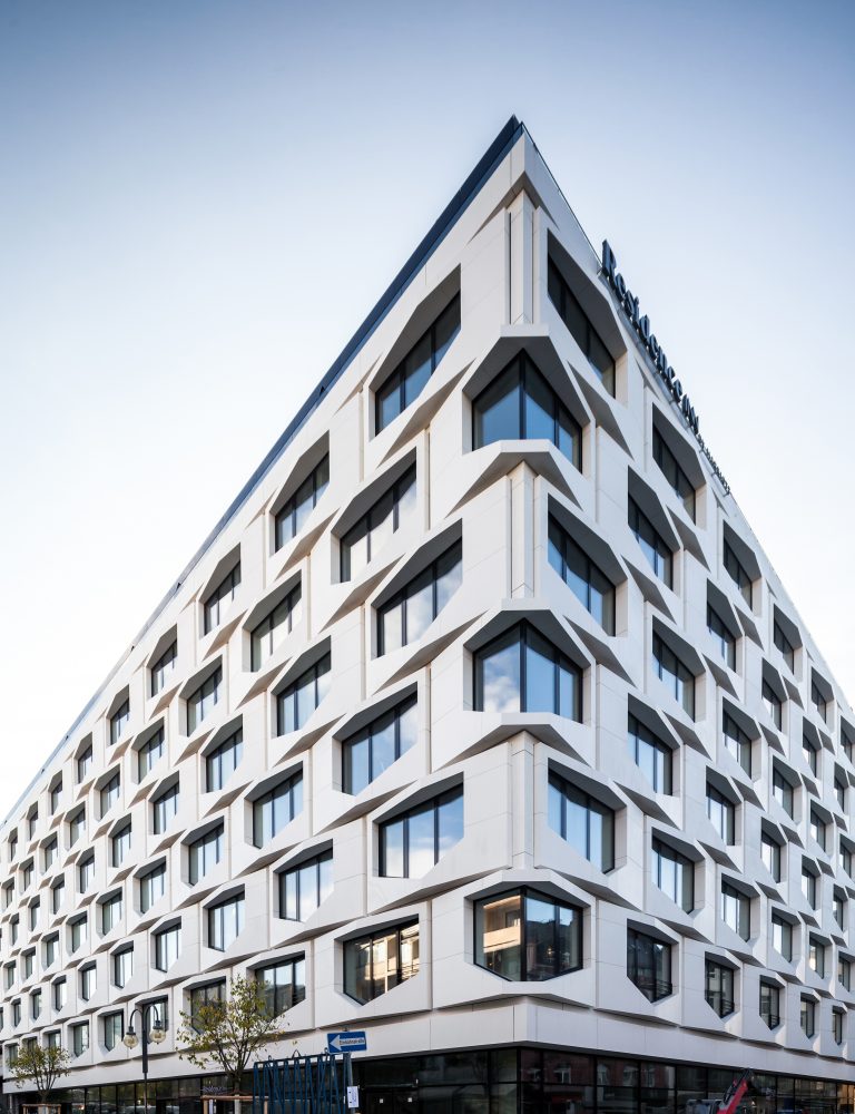 German hotel meets the street with a sintered stone facade - Facades+ ...