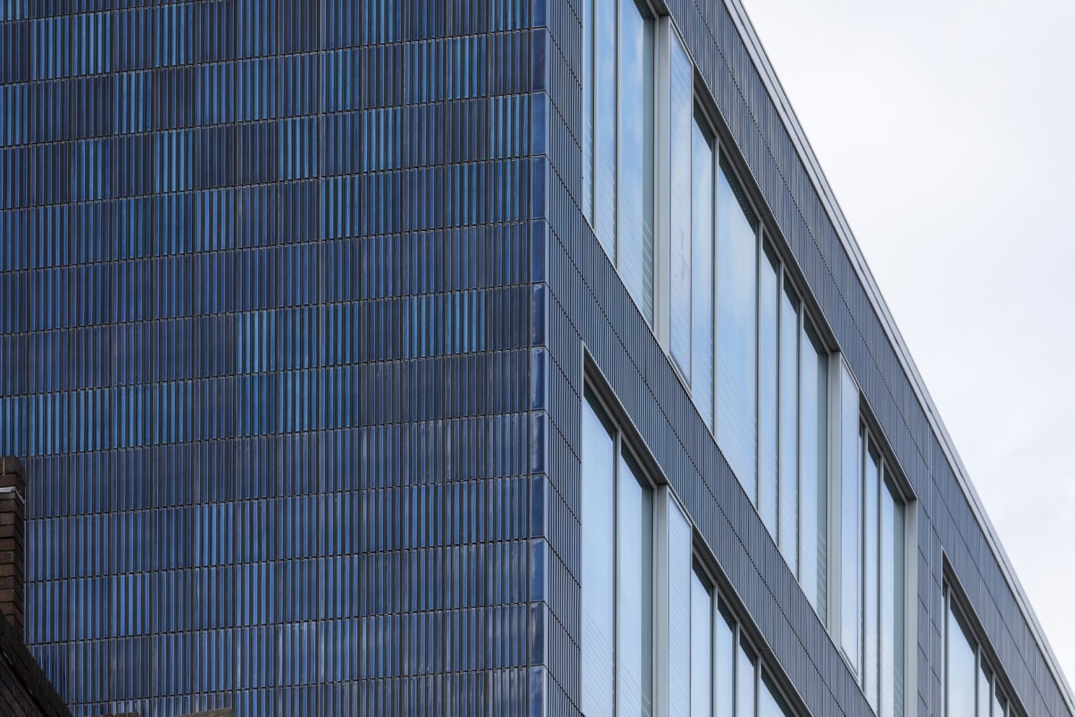 John Robertson Architects reclads the Academy House with ribbed and ...